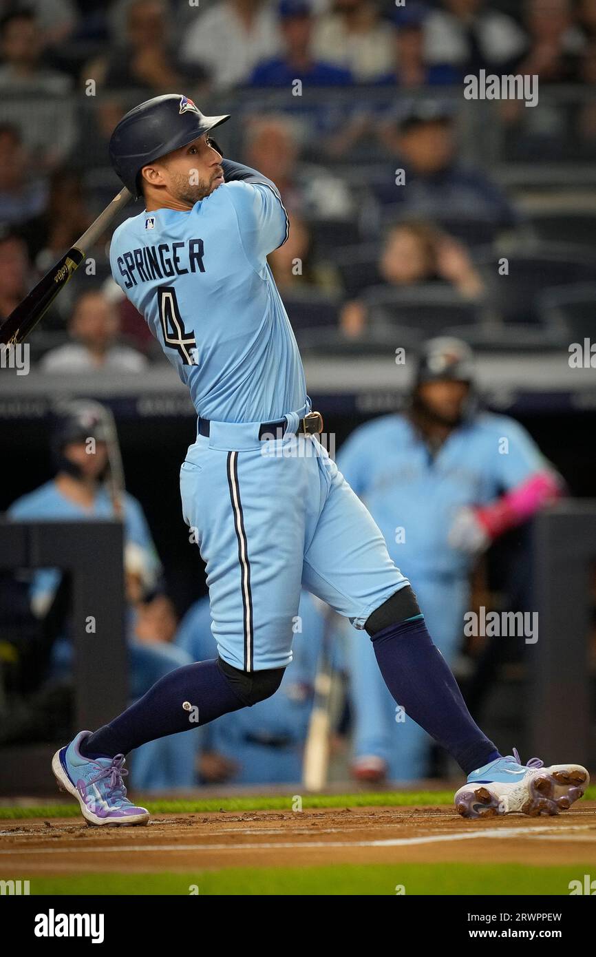 Toronto Blue Jays right fielder George Springer (4) hits a home run ...