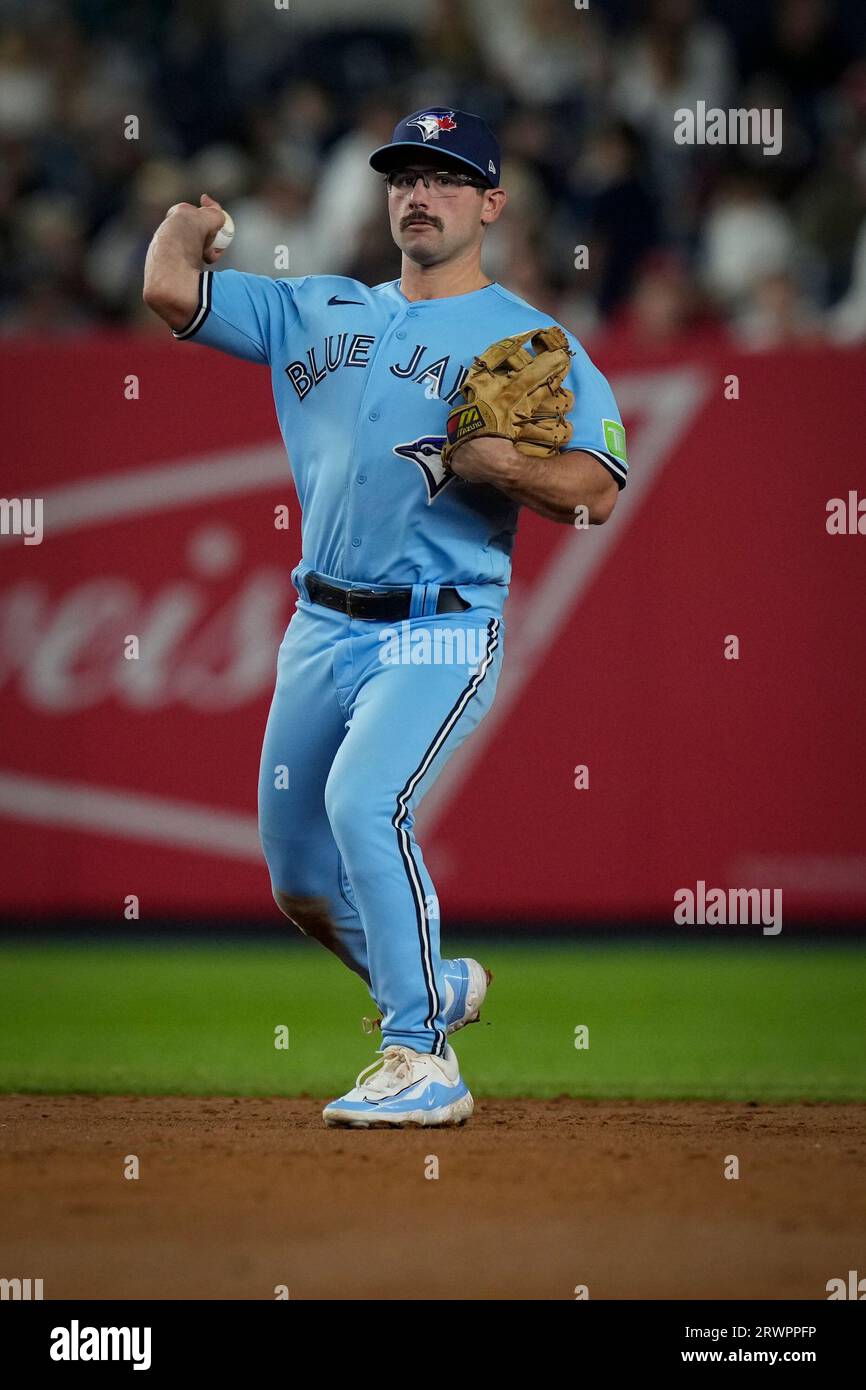 Toronto Blue Jays second baseman Davis Schneider (36) warms up between ...