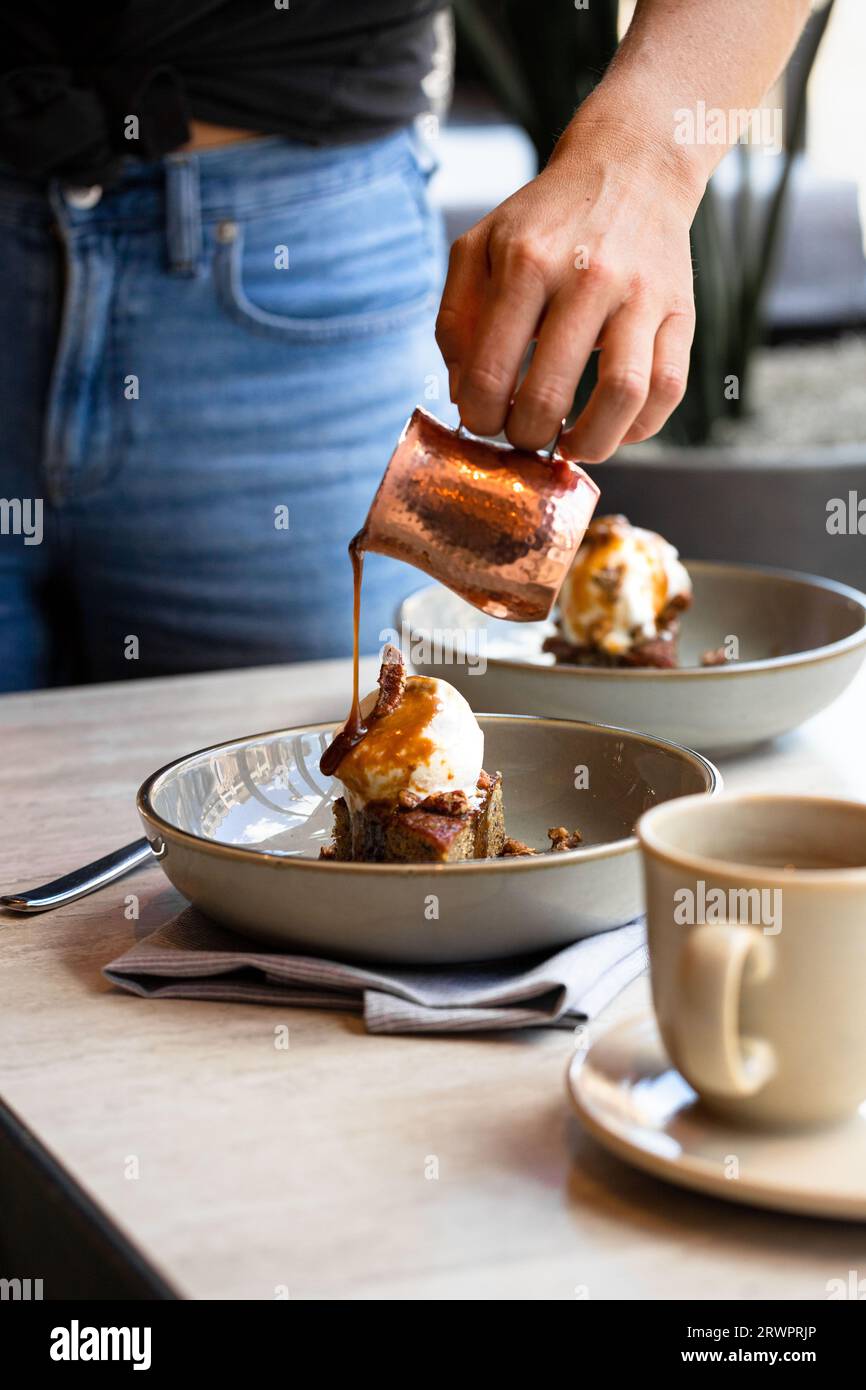 Caramel sauce over pudding cake Stock Photo - Alamy