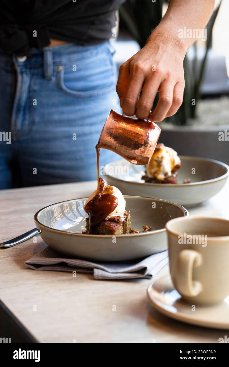 pouring caramel over cake Stock Photo - Alamy