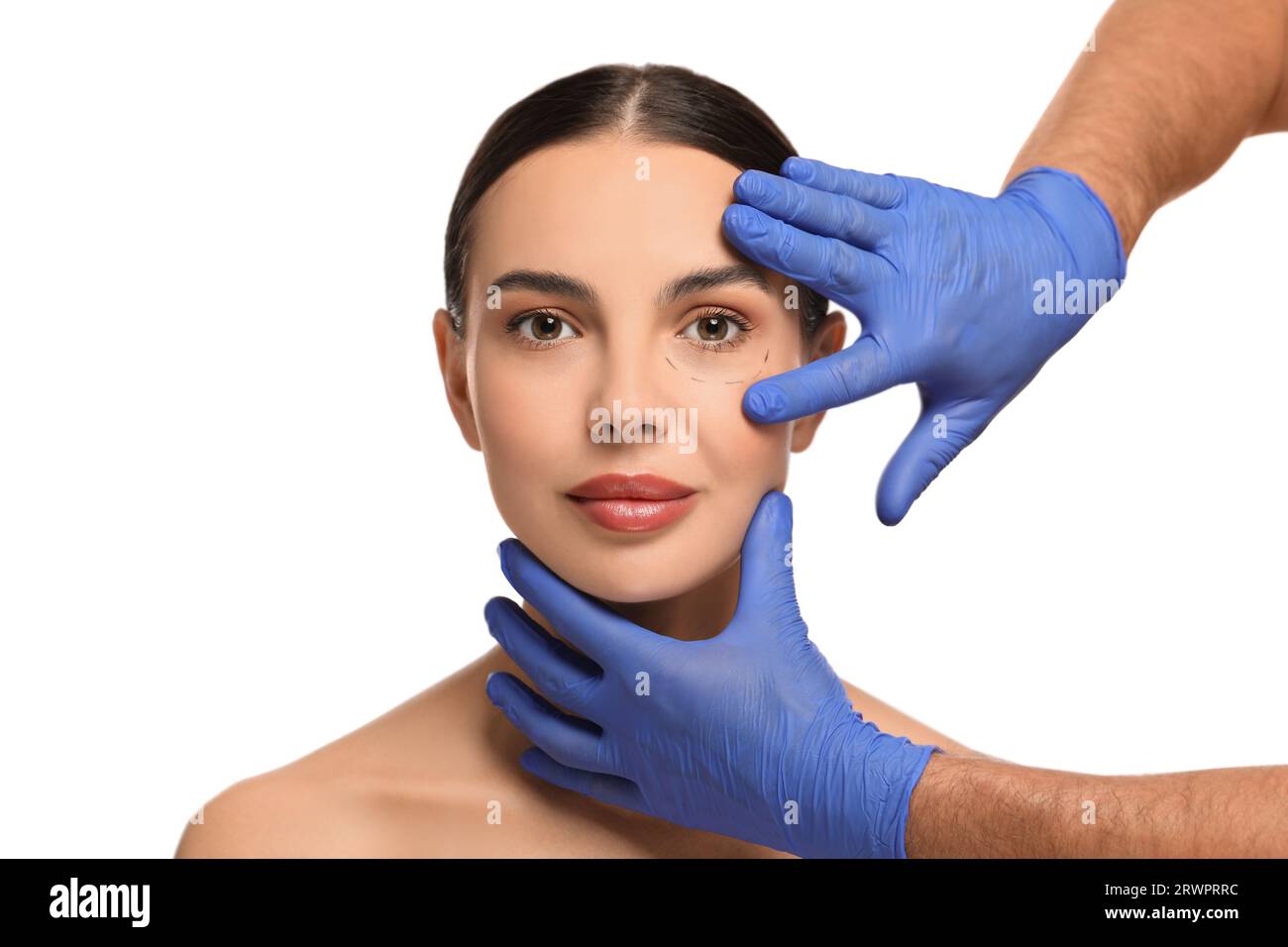 Doctor checking patient's face before cosmetic surgery operation on ...