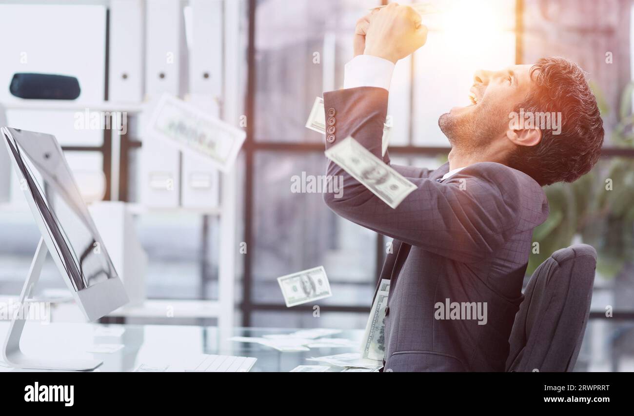 Shocking news. Surprised young man in a suit and tie looking at Stock ...