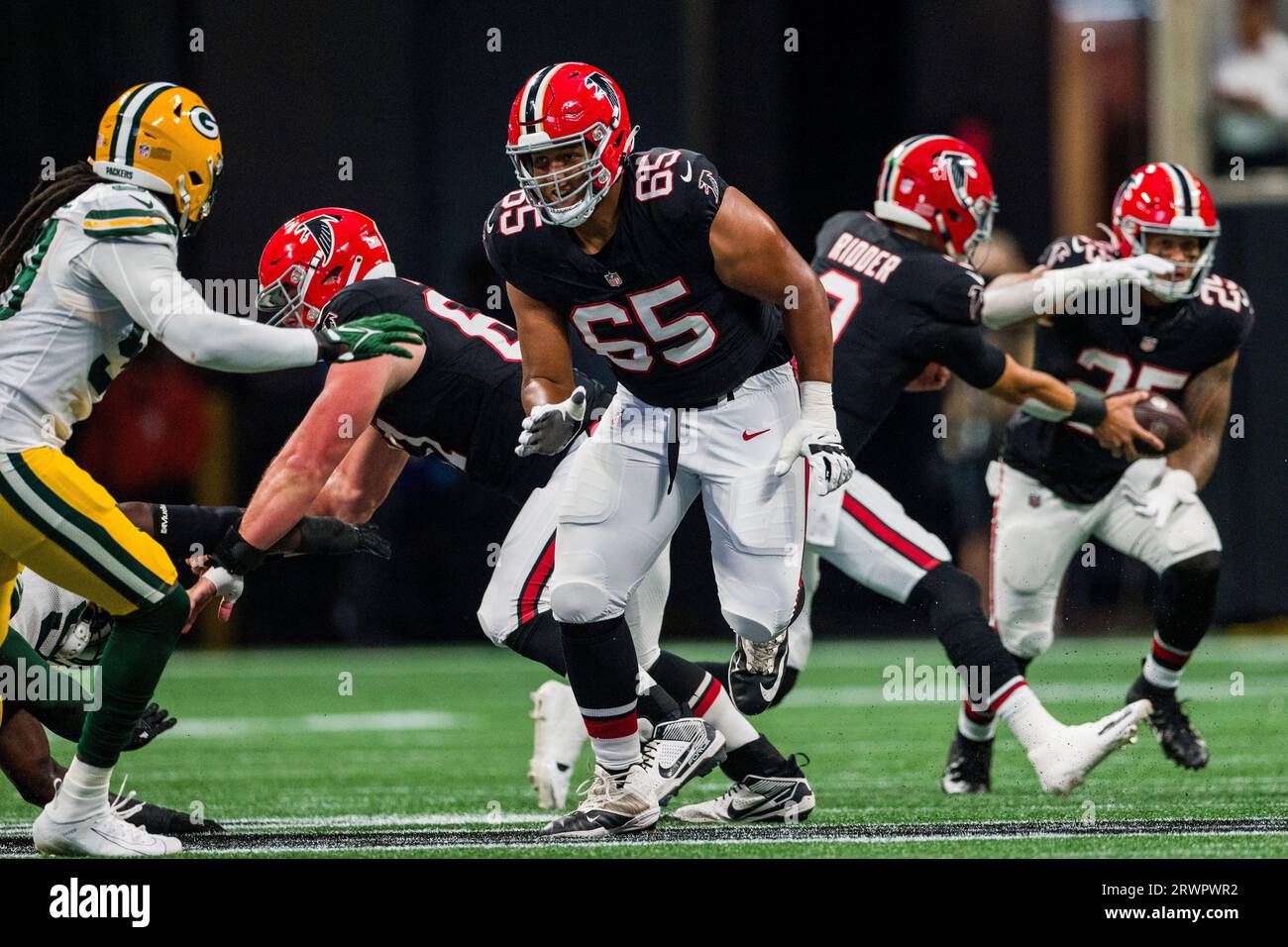 Atlanta Falcons guard Matthew Bergeron (65) works during the first half ...
