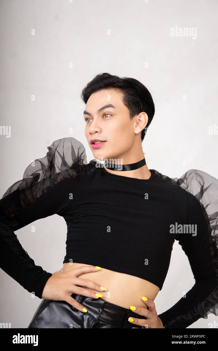 Beautiful Asian man wearing a black dance costume before the ...
