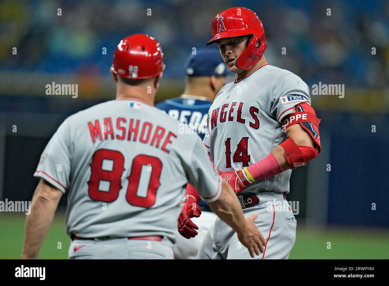 Los Angeles Angels' Logan O'Hoppe (14) celebrates with first base coach ...