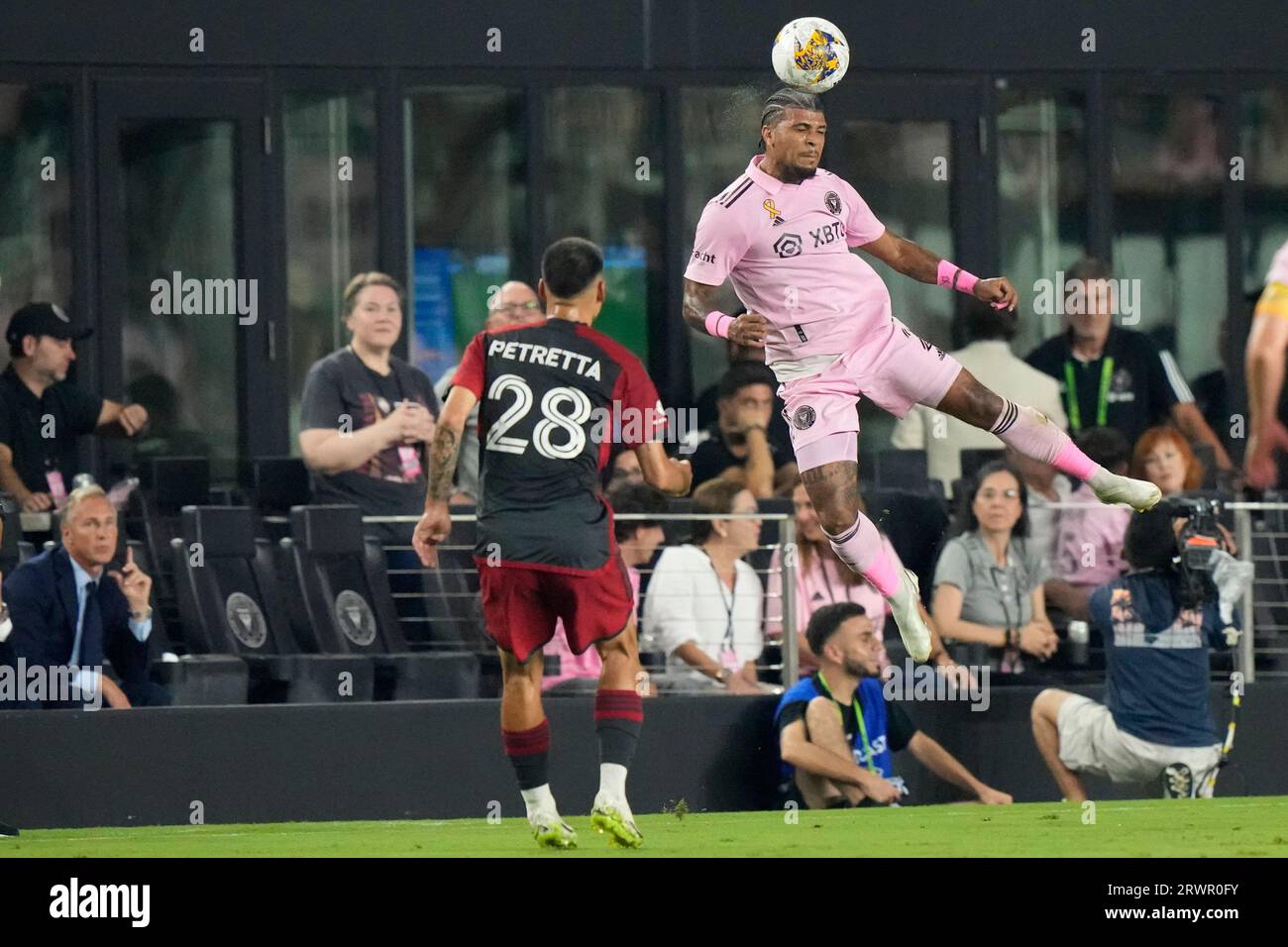 Inter Miami defender DeAndre Yedlin, right, heads the ball against ...