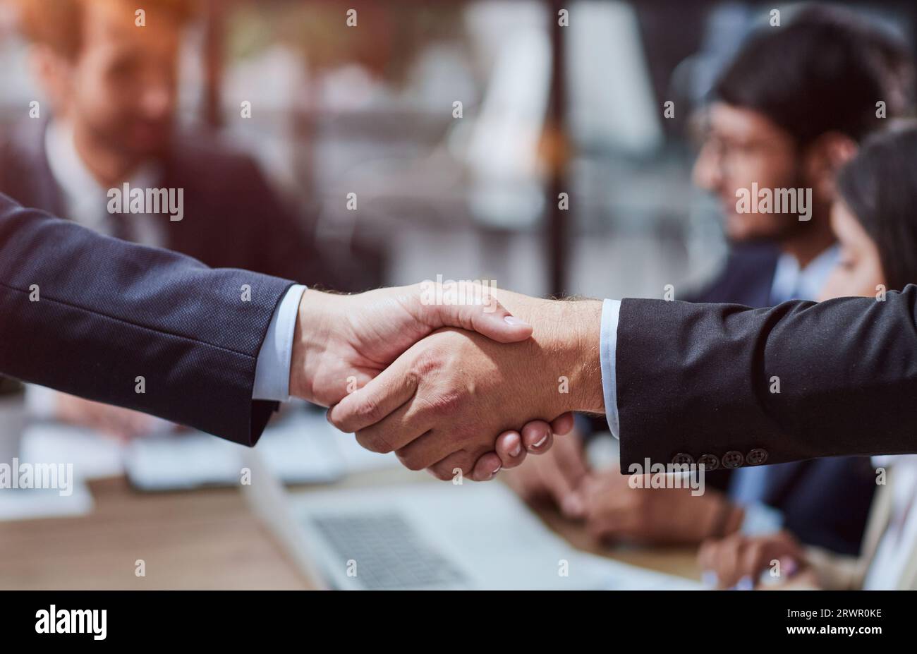 Business handshake. Shaking each other against the background of ...