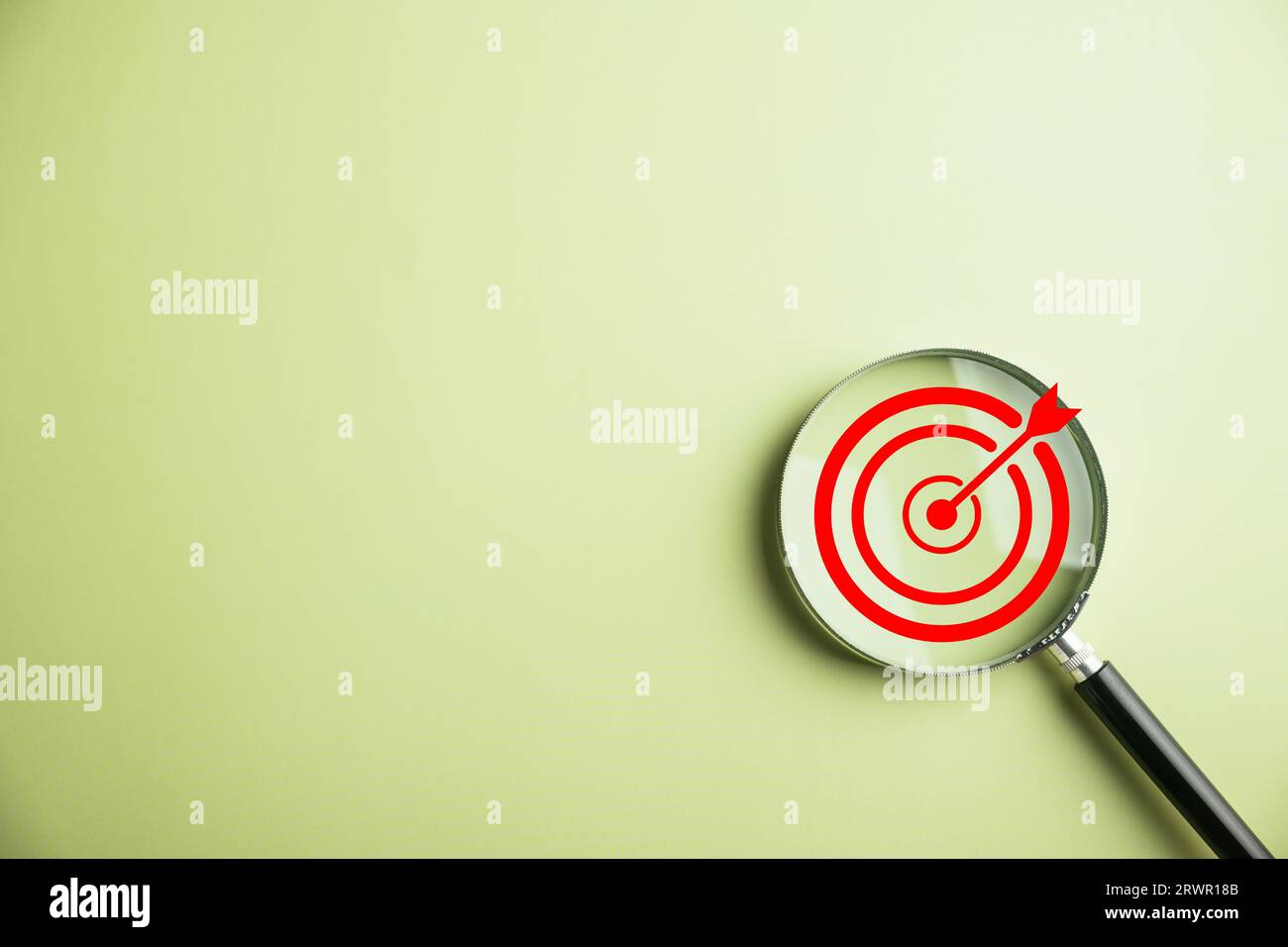 Target board inside magnifier glass for focus business objective Stock ...