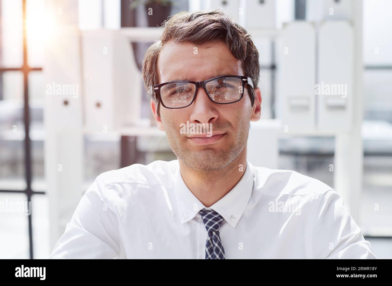 Confident young businessman posing in the office with his hands together Stock Photo - Alamy