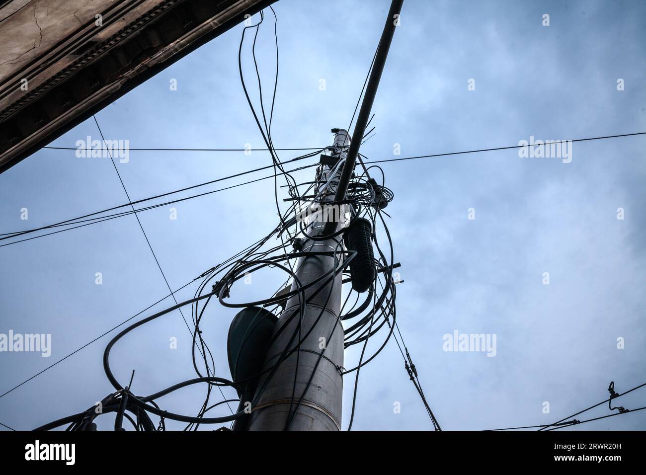 Picture of a messy power line connection with a lot of cables going ...