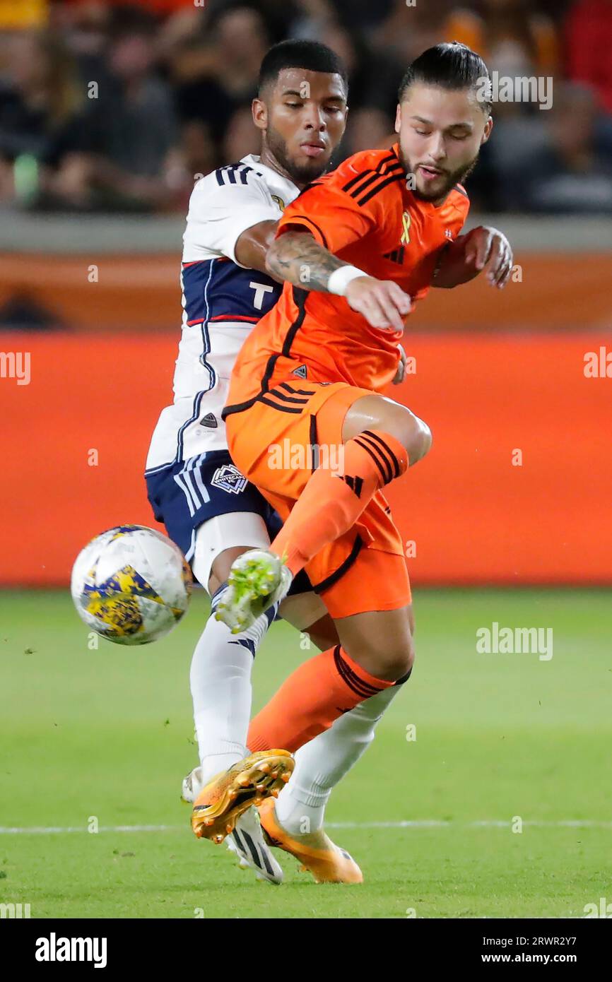Houston Dynamo midfielder Sebastian Kowalczyk, right, blocks out ...