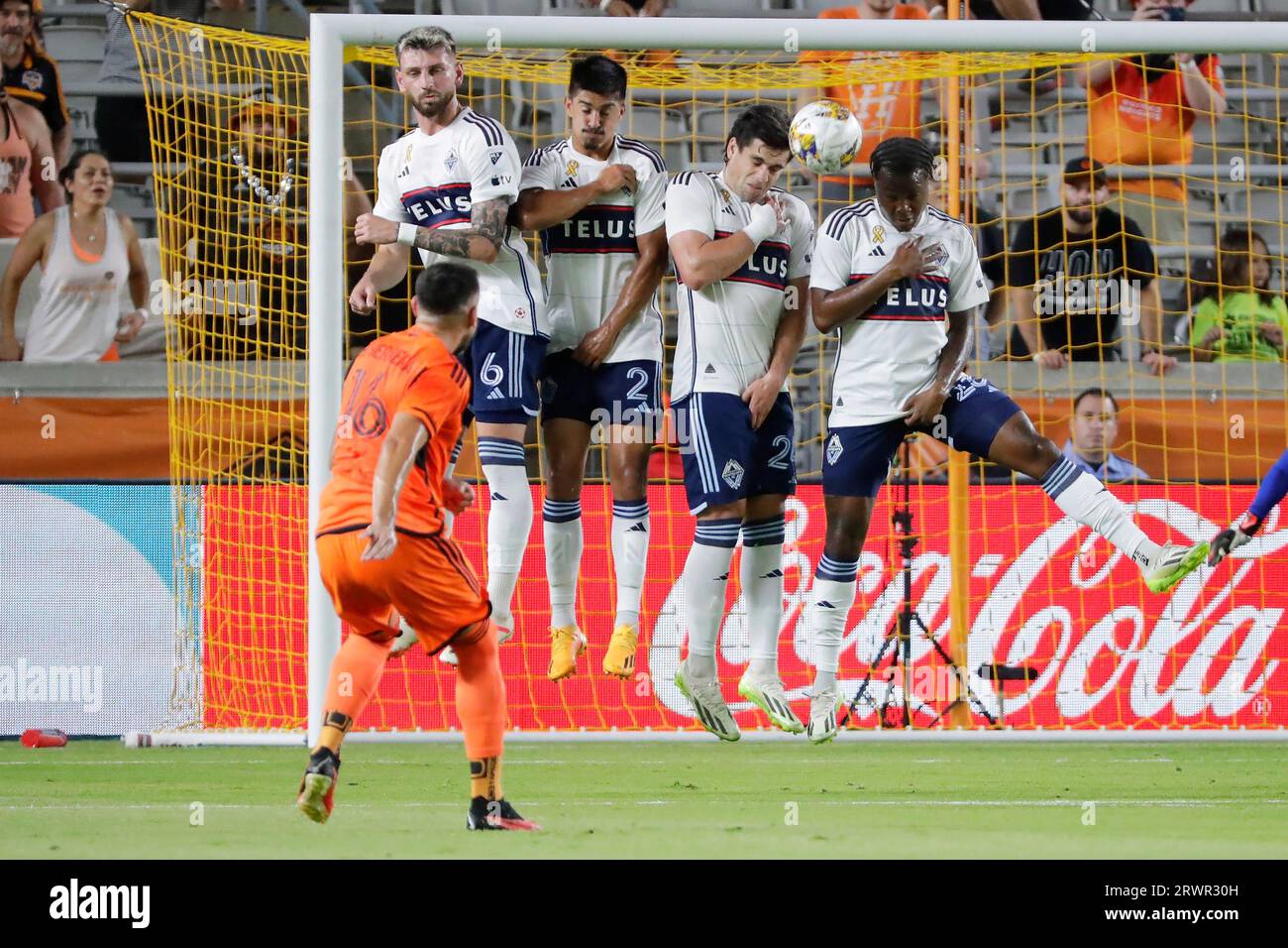 Houston Dynamo midfielder Hector Herrera (16) scores on a penalty kick as Vancouver Whitecaps ...