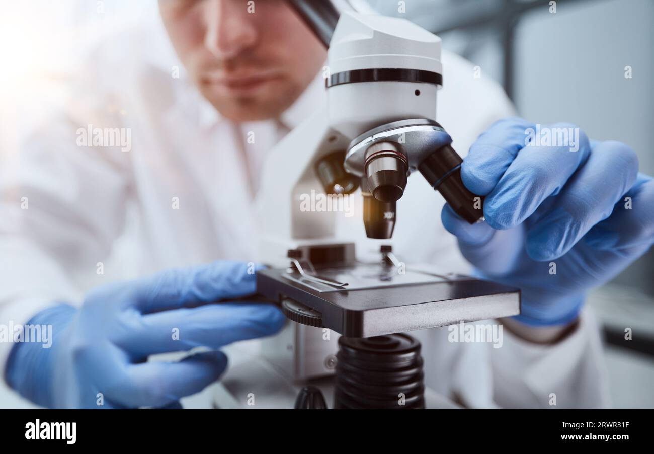 biologist explores the substance under the microscope Stock Photo - Alamy