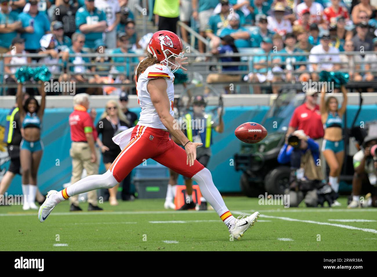 Kansas City Chiefs punter Tommy Townsend (5) kicks the ball away during ...
