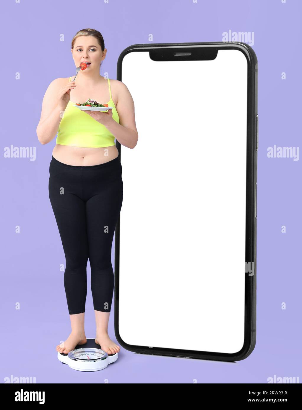 Big smartphone and overweight woman with salad standing on scales ...