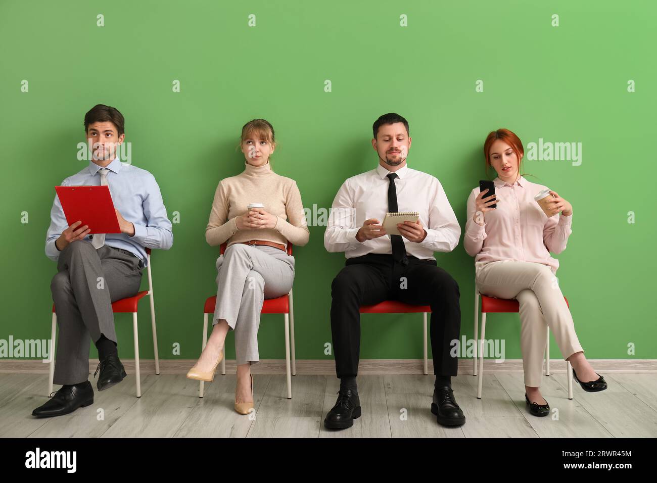 Young applicants waiting for job interview in room Stock Photo - Alamy