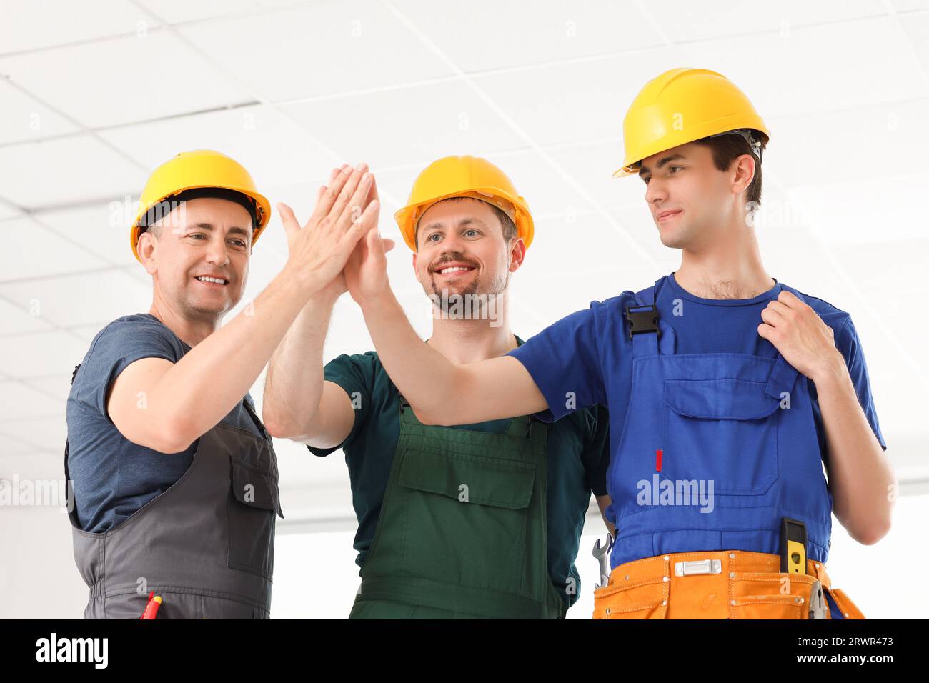 Builders hands together hi-res stock photography and images - Alamy