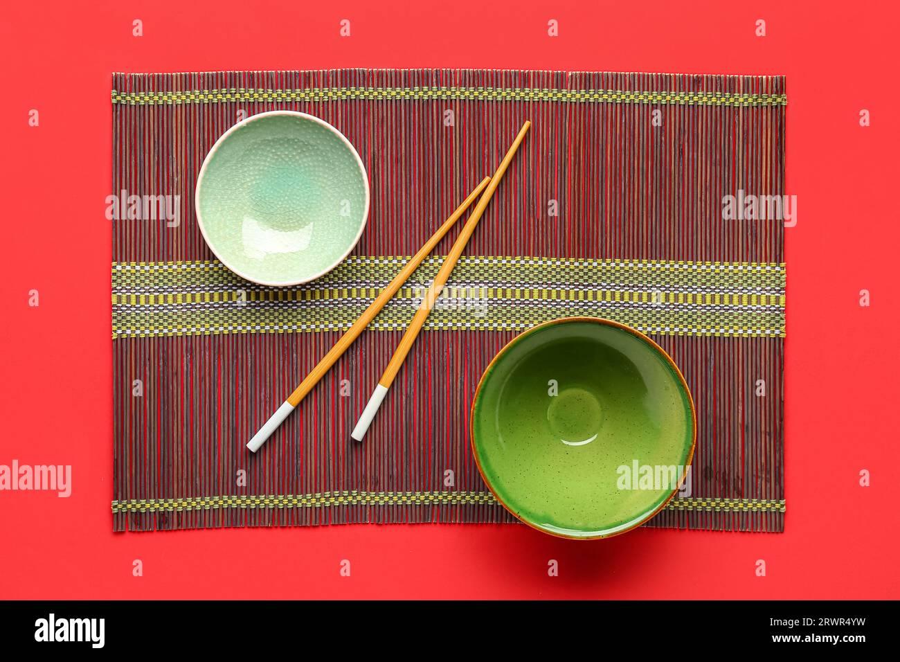 Chinese table setting on red background Stock Photo - Alamy