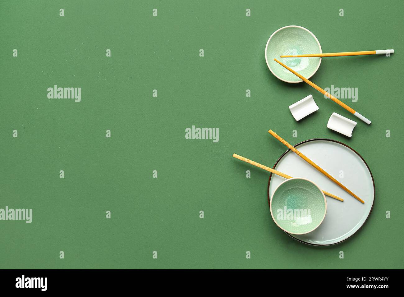 Chinese table setting on green background Stock Photo - Alamy