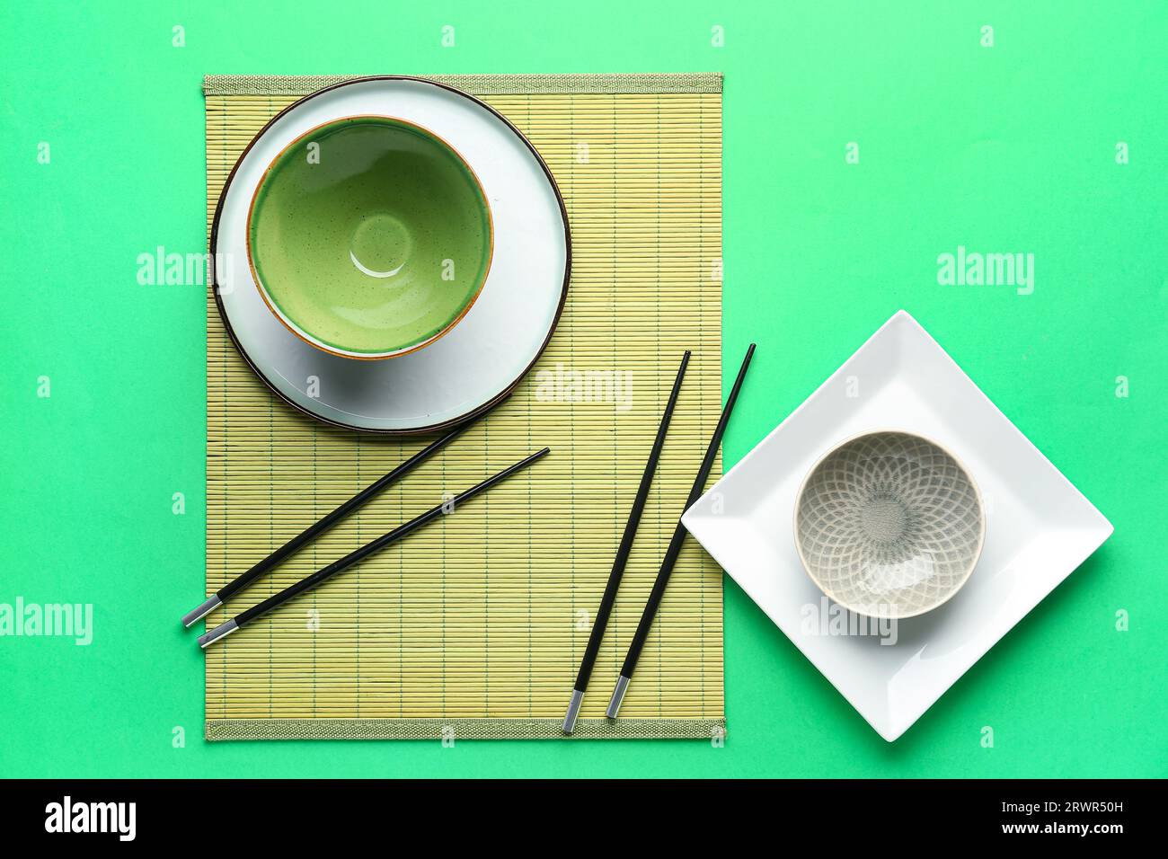 Chinese table setting on green background Stock Photo - Alamy