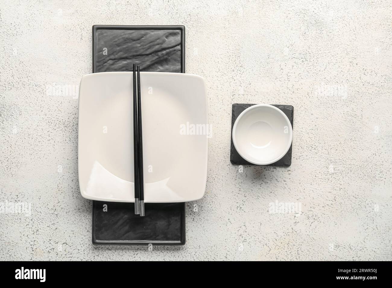 Chinese table setting on light background Stock Photo - Alamy