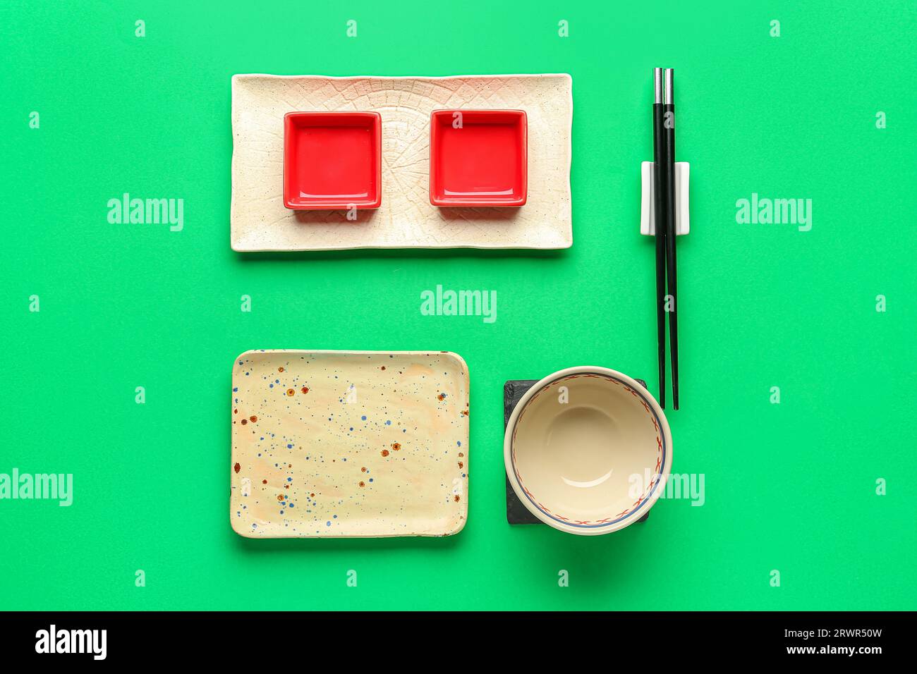 Chinese table setting on green background Stock Photo - Alamy