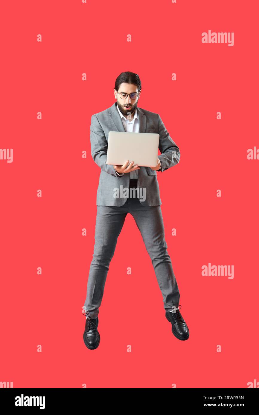 Man suit jumping laptop hi-res stock photography and images - Alamy