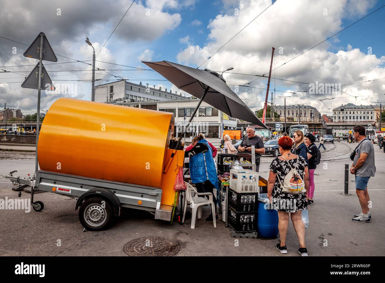 Picture of a female selling kvas in a street of Riga, Latvia. Kvass is ...
