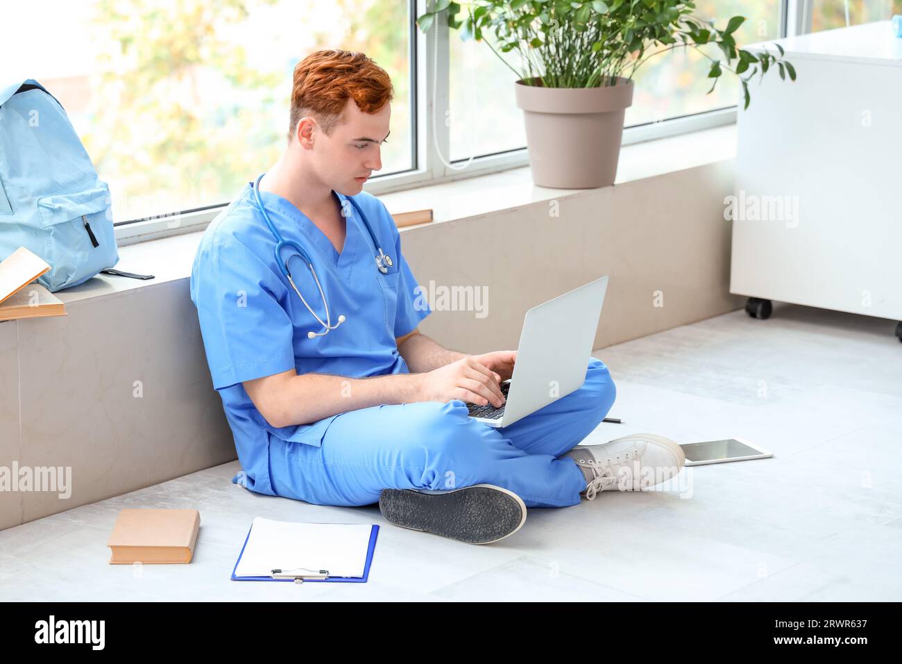 Male medical student studying with laptop at university Stock Photo - Alamy