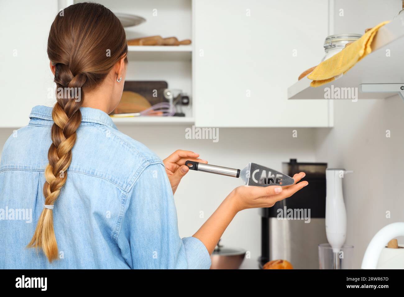 Woman putting spatula kitchen hi-res stock photography and images - Alamy