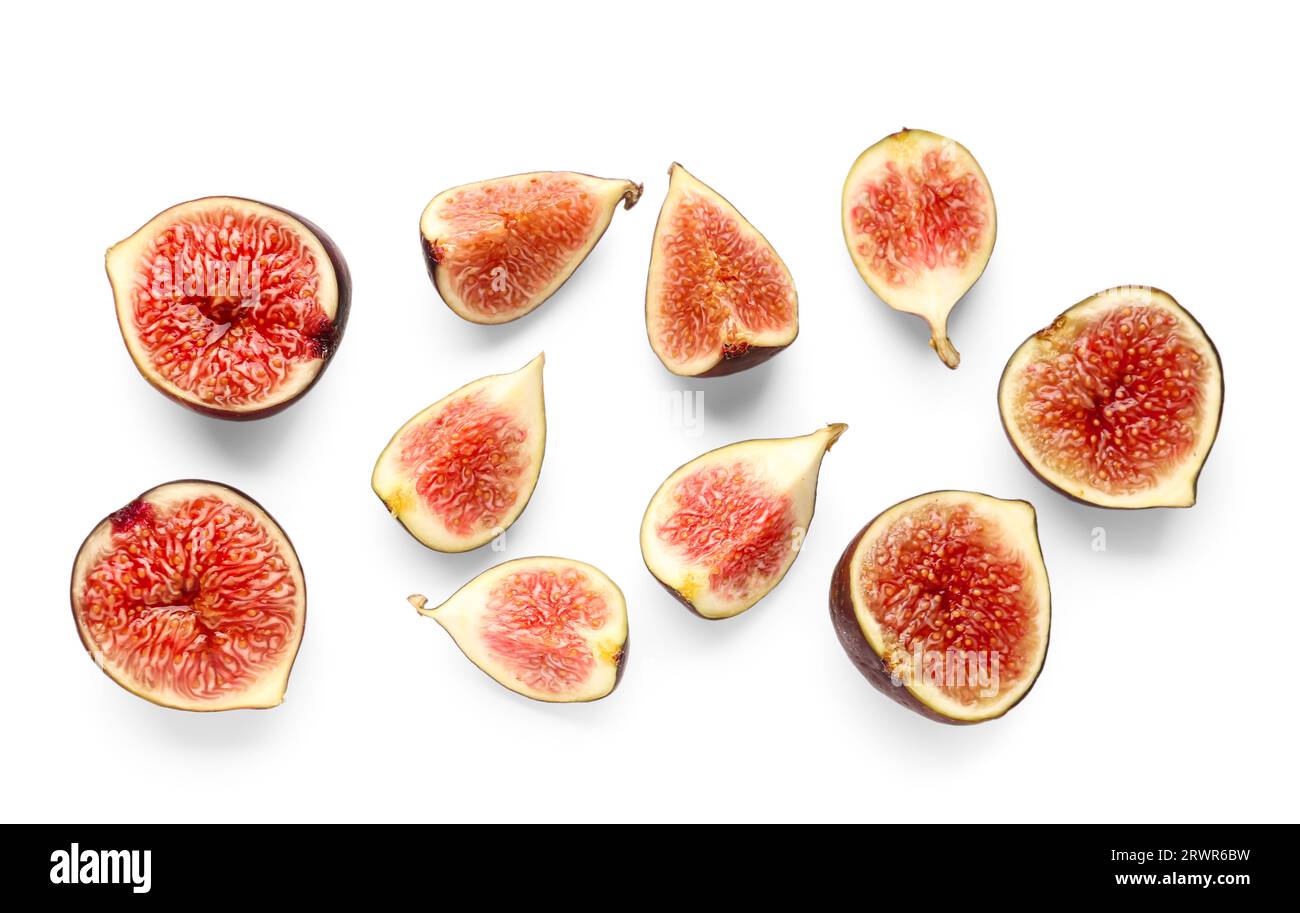 Cut fresh ripe figs on white background Stock Photo - Alamy