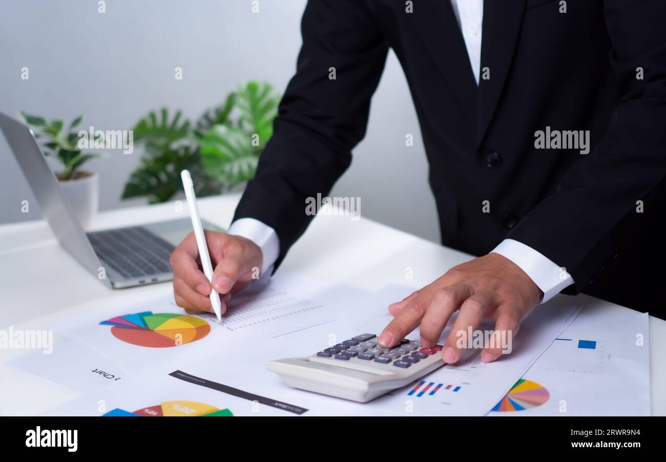 Business development ideas for success and growth. Businessman taps pen ...