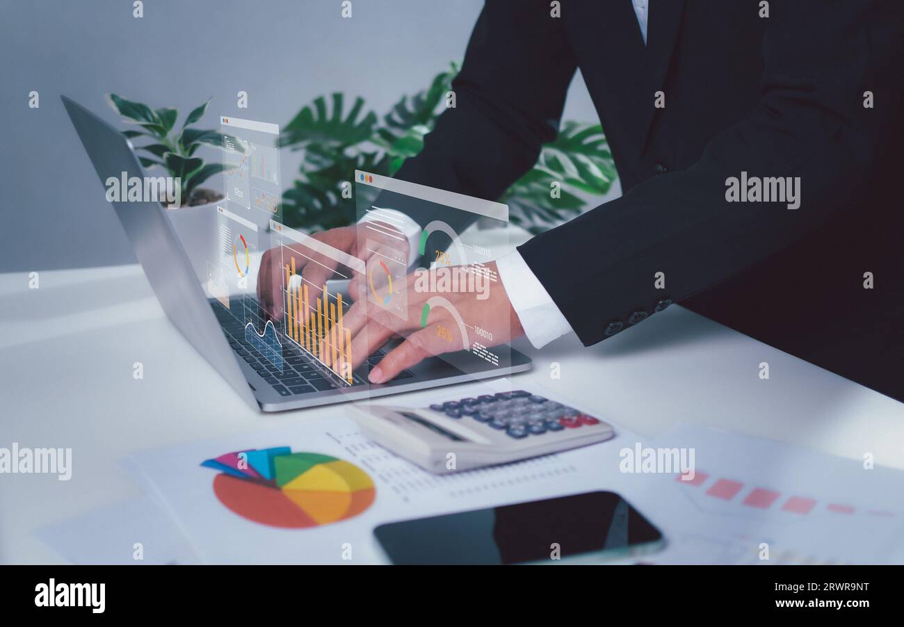 Business people use computers to analyze business and manage corporate ...