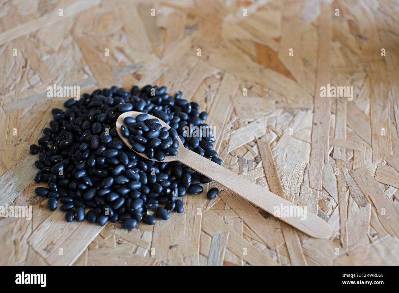 black beans on table and wooden spoon Black beans are good for health ...