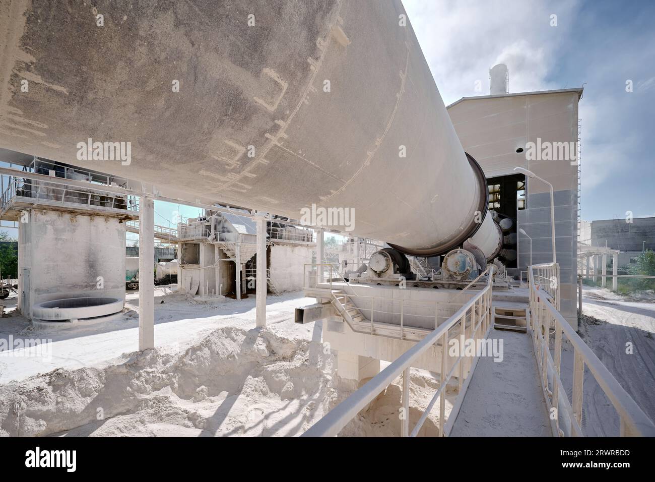 Big tubular rotary furnace and operating equipment at plant Stock Photo ...