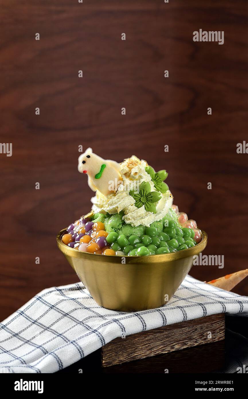 Korean shaved ice dessert with sweet toppings, matcha red beans Bingsu ...