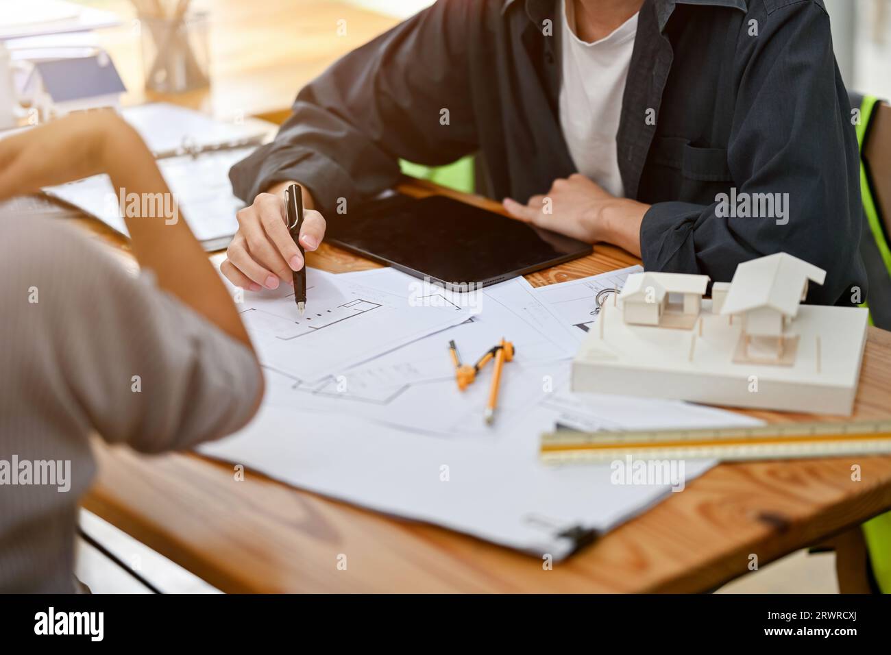 Architect plans house client hi-res stock photography and images - Alamy