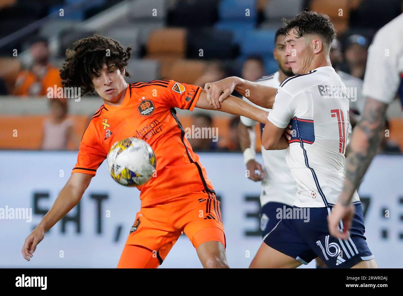 Houston Dynamo forward Ivan Franco (7) is pulled by the arm by ...