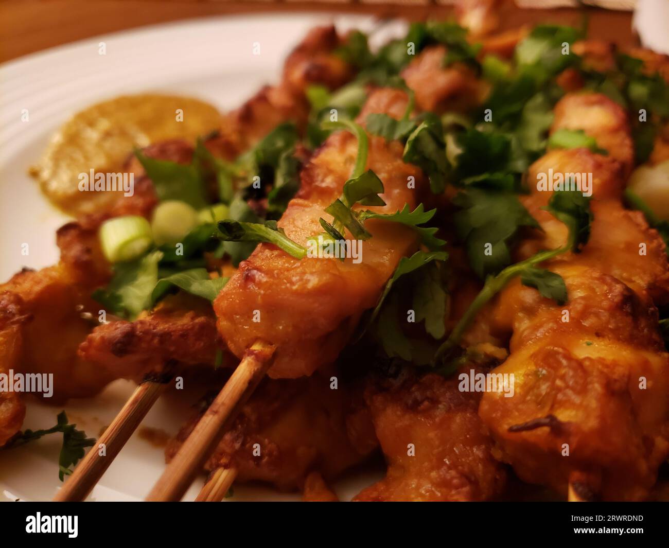A plate of delicious Asian chicken satay served Stock Photo - Alamy