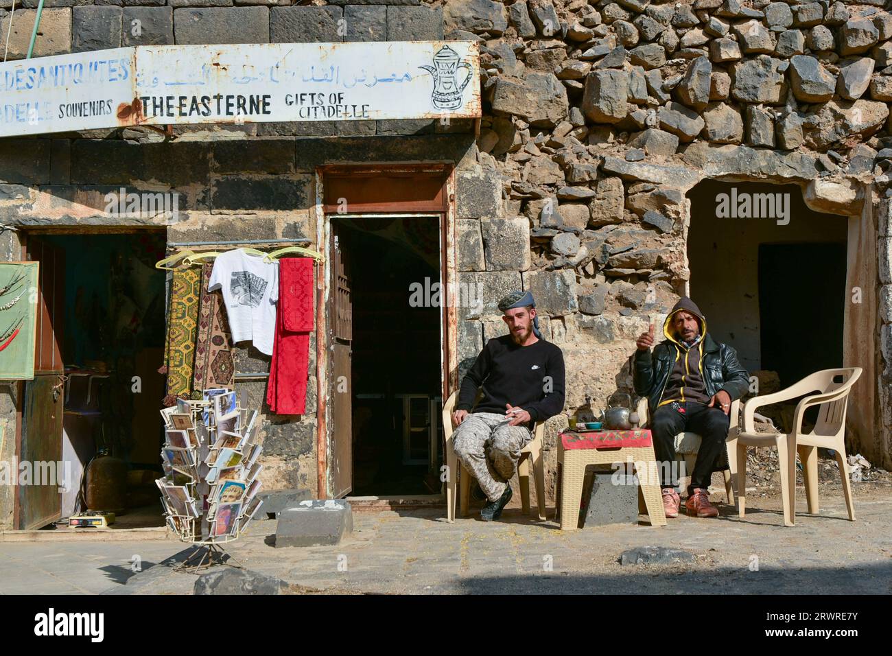 Locals outside the Roman Theatre in Bosra, Syria, in territories ...