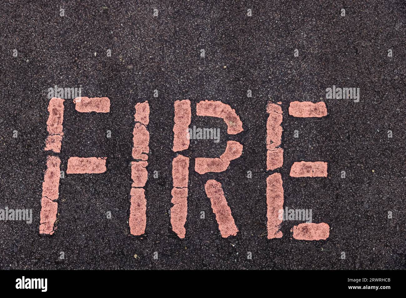A mesmerizing inscription,etched by fire,stretches across the asphalt ...