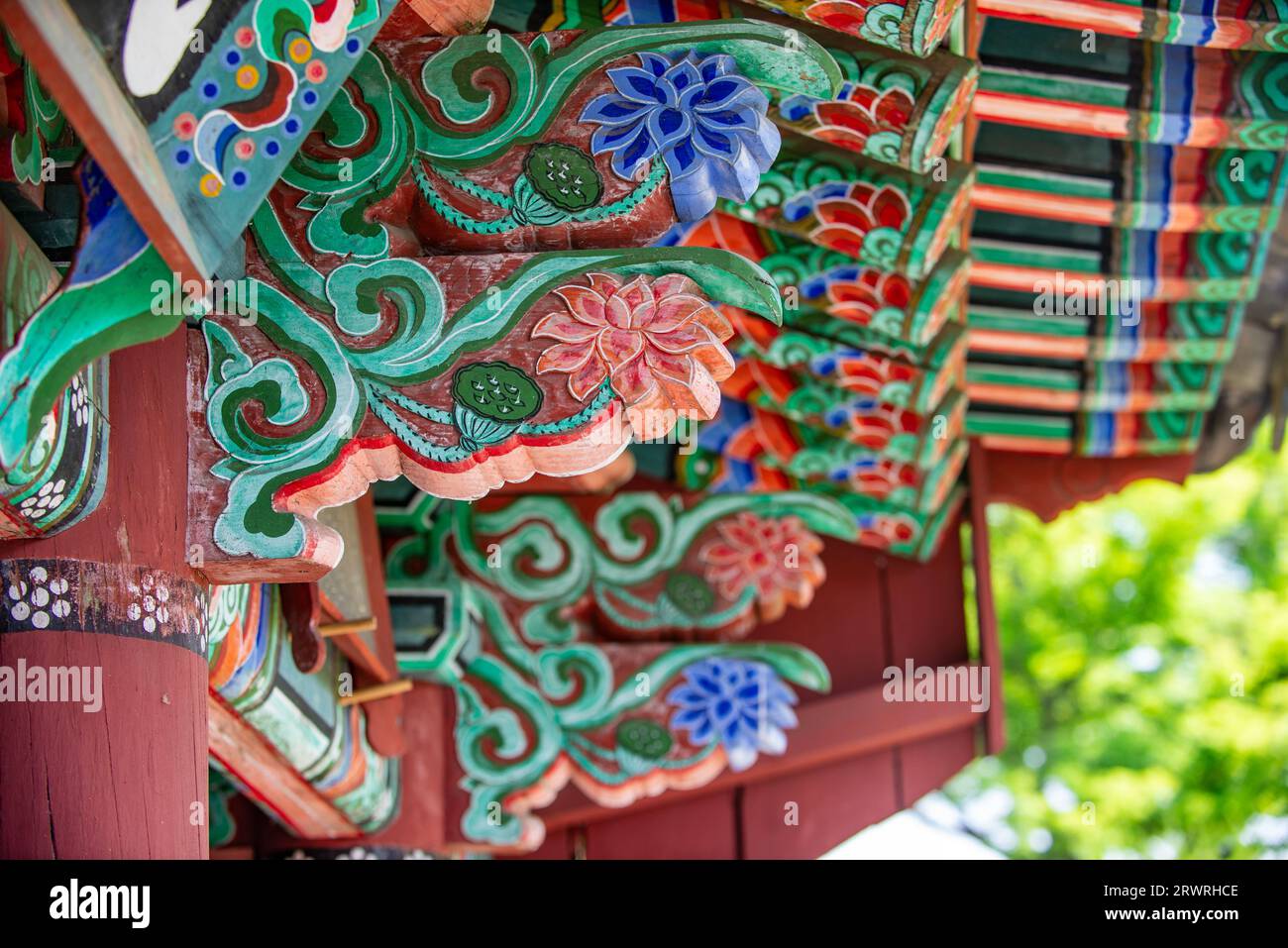 Close up of decorative and colourful carved roof design in traditional ...