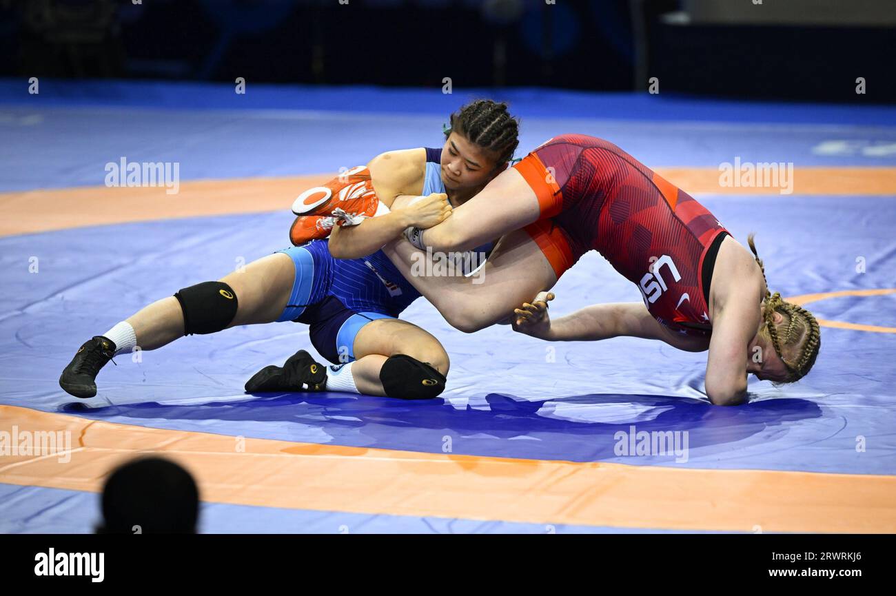 Nonoka Ozaki (L) of Japan grasps Macey Ellen Kilty of the United States ...