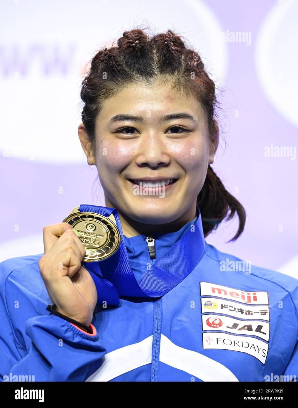 Nonoka Ozaki of Japan poses with her women's 65-kilogram gold medal at the world wrestling ...