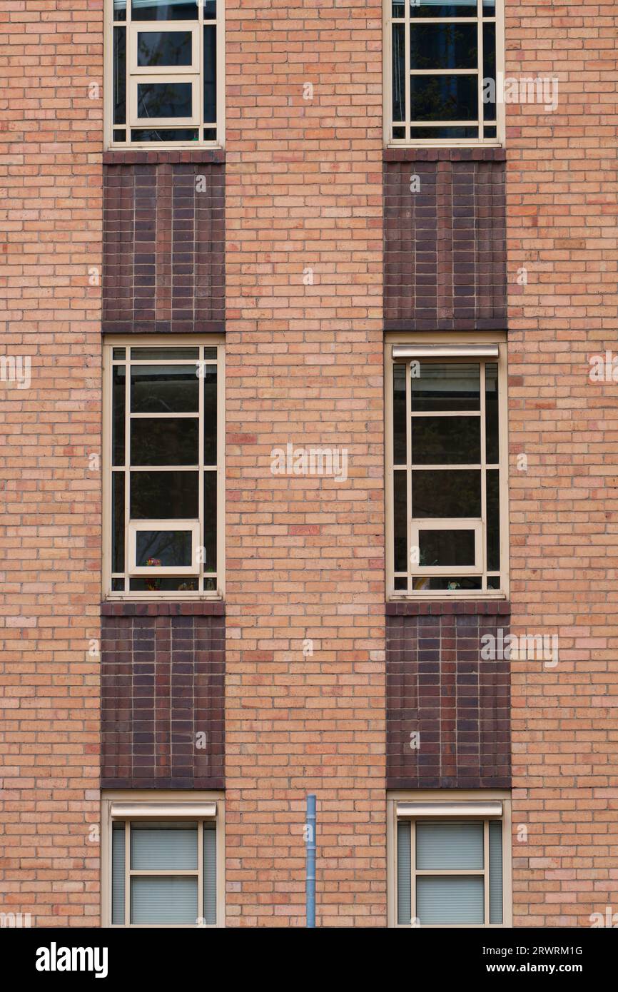 Abstract building minimal design with patterns, glass windows and brick ...