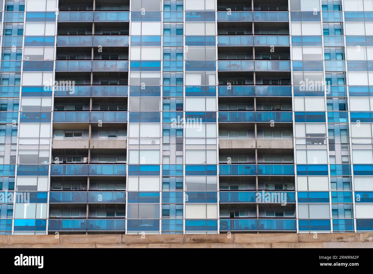 Symmetrical view of modern city building apartment block with small ...