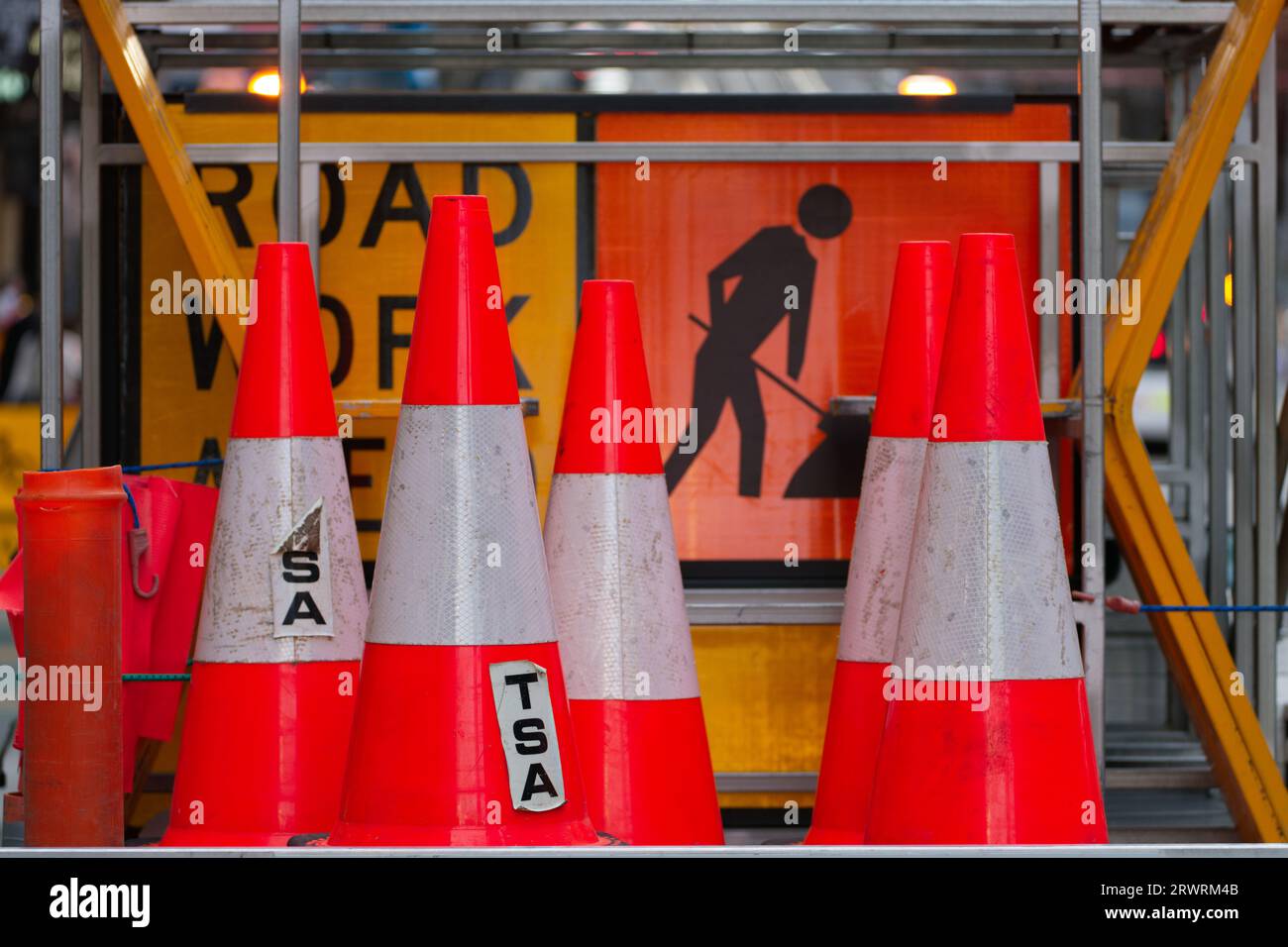 Safety orange traffic cones and roadwork traffic control equipment near ...