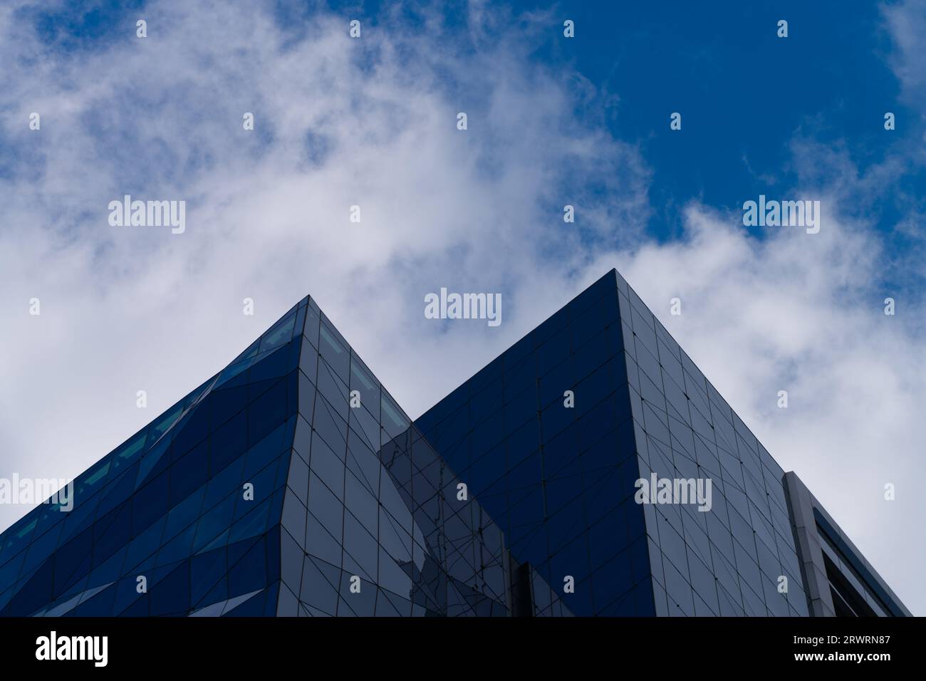 Abstract glass office building architecture showing window patterns ...