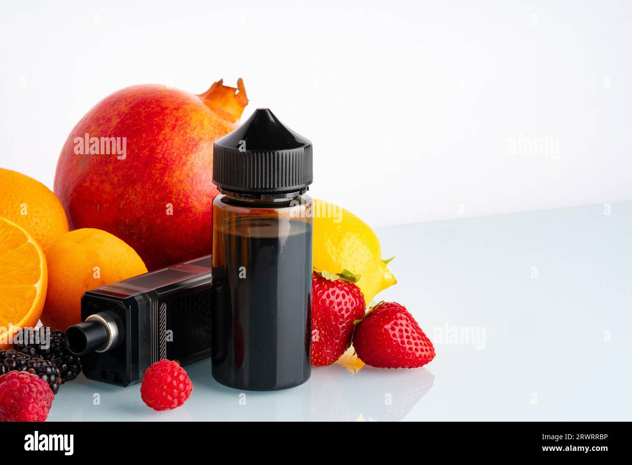Vape and smoking liquid with fruit flavor on white background Stock ...