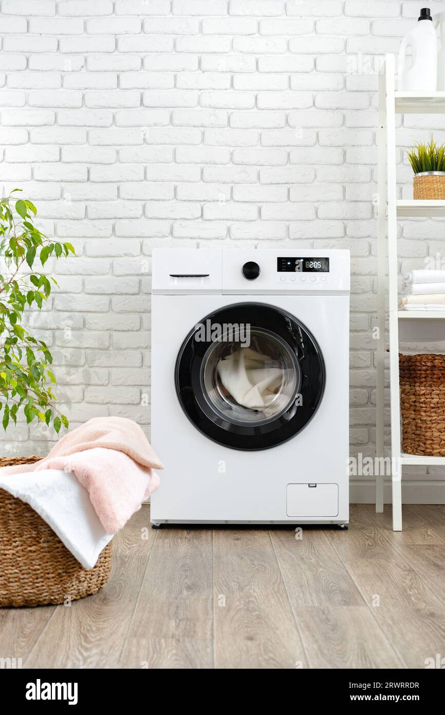 Modern white washing machine close up photo Stock Photo - Alamy